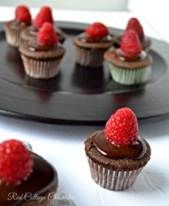 Two bite Mini Chocolate Raspberry Cupcakes with fresh raspberries